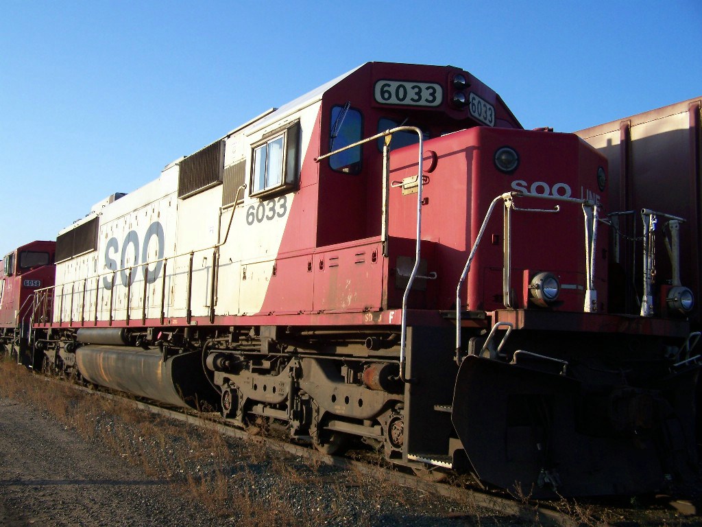 Soo 6033, the last Soo SD60 seen working o the CP by this photographer, waits for its fate in ...